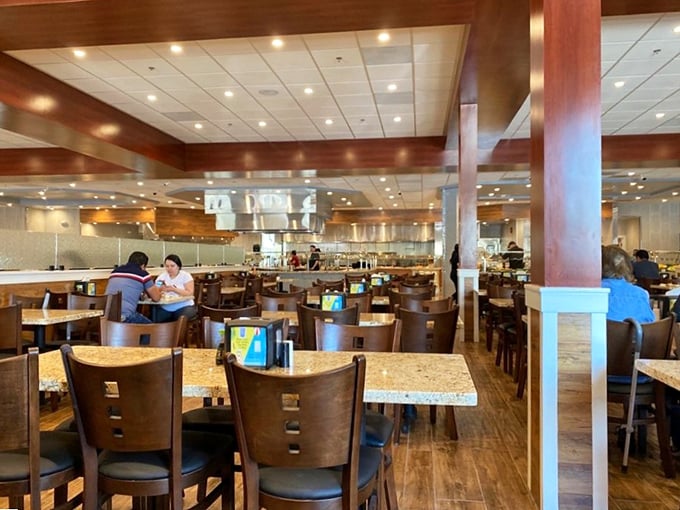 Inside, warm wood tones and granite tables create an atmosphere that says, "Stay awhile and have that third plate—we both know you're going to anyway."