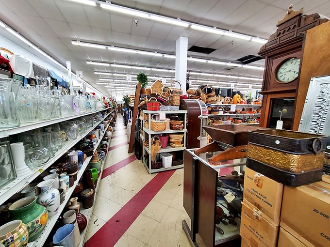 Aisles that stretch into infinity, where glassware meets furniture meets mystery boxes. Indiana Jones would call this "the temple of secondhand treasures."