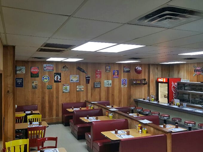 Classic wood paneling and vintage signs aren't trendy design choices here—they're time capsules from when conversations happened face-to-face instead of screen-to-screen.
