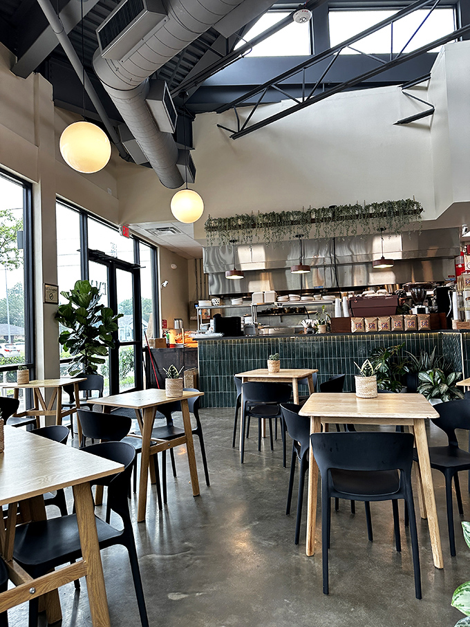 High ceilings, hanging plants, and honest design create a space that feels both airy and intimate. Like a stylish friend's dining room – if your friend were a culinary genius.