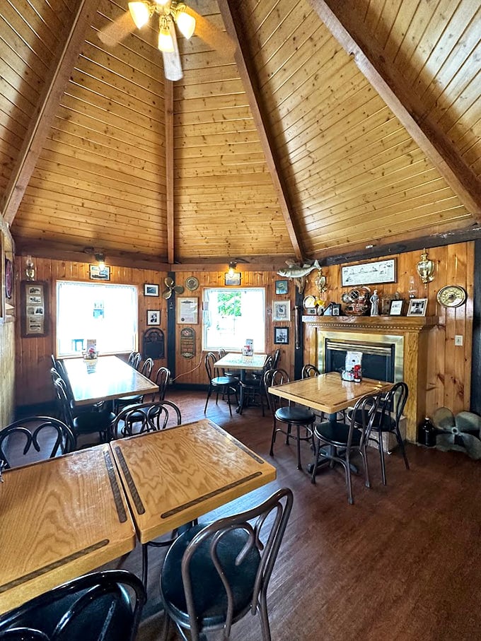 The cathedral-like wooden ceiling and nautical-themed walls create an atmosphere that's part fishing cabin, part seafood sanctuary. Comfort never looked so charming.