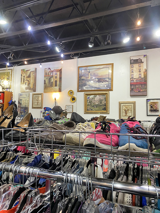 Wall-to-wall wonders await inside, where framed artwork transforms ordinary retail space into a gallery of possibility among carefully organized clothing racks.