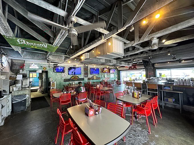 Inside, industrial-chic meets coastal casual with exposed beams, red chairs, and just enough nautical decor to remind you why you're here: seriously fresh seafood.