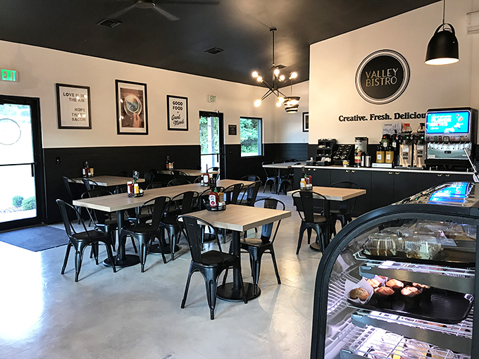 Clean lines, black and white aesthetics, and motivational wall art create a space that says "serious about food, but not about pretension."
