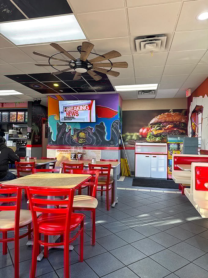 Inside, vibrant murals and that rustic windmill ceiling fan create the perfect backdrop for breakfast magic. Red chairs invite you to settle in for the main event.