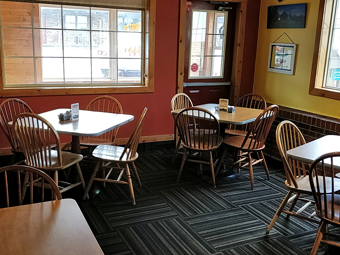 Windsor chairs and warm-colored walls create that "grandma's kitchen" vibe we all crave. No designer needed—just genuine small-town comfort.
