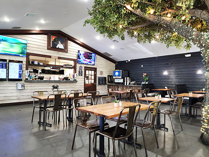 Inside, modern rustic meets seafood sanctuary. That illuminated tree isn't the only thing bringing warmth to this inviting space.