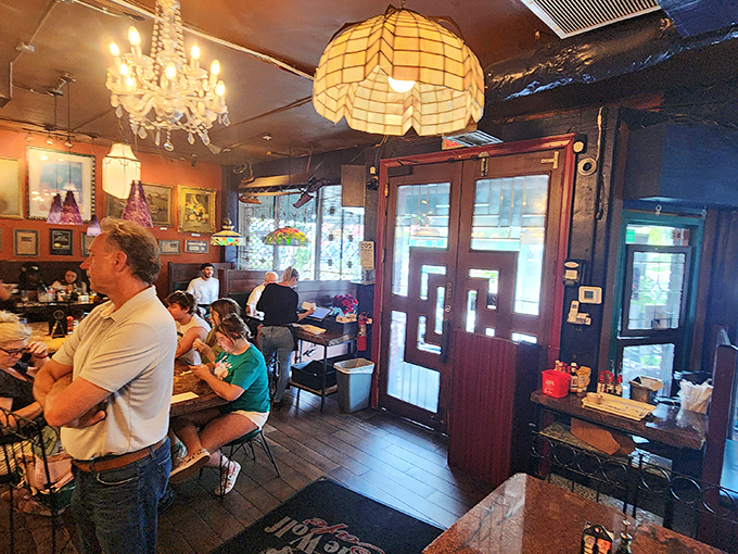 Step inside and you're transported to a wonderland of chandeliers, vintage lamps, and eclectic artwork—like dining in your fascinating great-aunt's living room.