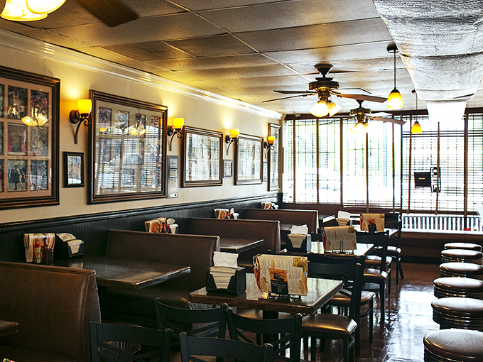 Warm lighting, wood paneling, and cozy booths create that rare atmosphere where memories are made before the food even arrives.