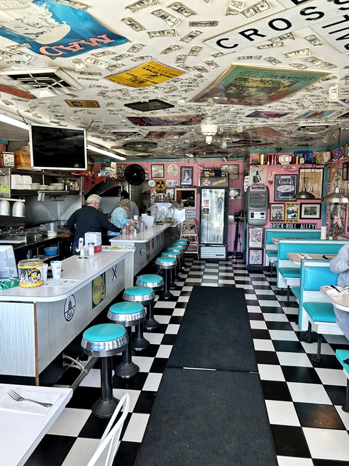 Step inside and the 1950s never ended – checkered floors, turquoise stools, and a ceiling plastered with vinyl records. This isn't decoration; it's a full-blown time machine.