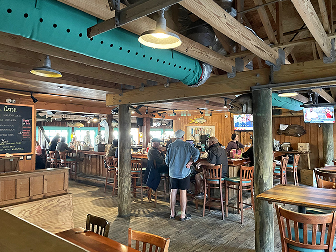 Rustic wooden beams and teal accents create that perfect "coastal casual" vibe—like your favorite beach cabin suddenly learned how to cook.