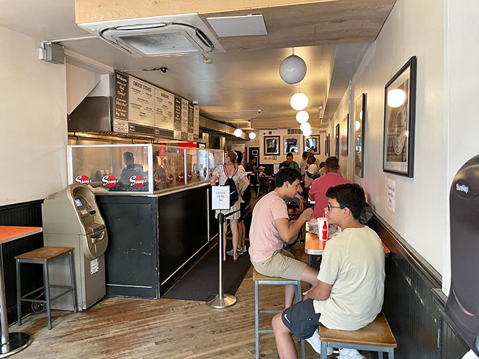 Inside this narrow sanctuary of sandwich perfection, pilgrims line up for their chance at cheesesteak nirvana. Worth every minute of the wait.