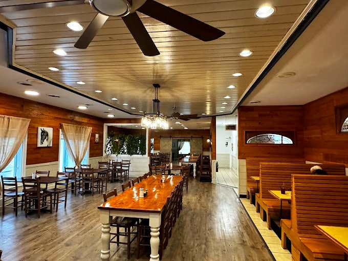 Wooden paneling, farmhouse tables, and that unmistakable aroma of possibility—this dining room knows comfort isn't just about the food.