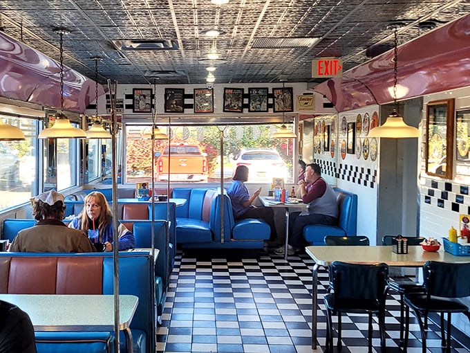 Step inside and you're transported to the 1950s—blue vinyl booths, checkered patterns, and a pressed tin ceiling create the perfect backdrop for breakfast bliss.