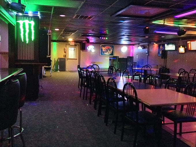Colorful lights transform this casual dining space into something between neighborhood hangout and disco fever dream—all that's missing is John Travolta.