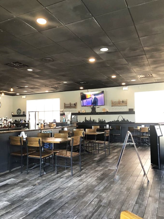 Industrial meets cozy in this thoughtfully designed space where wooden tables, metal chairs, and that weathered floor say, "Stay awhile, the food's worth it."