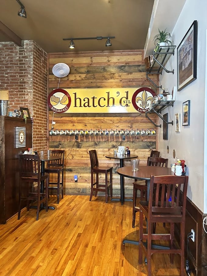 Coffee mugs hanging like trophies against reclaimed wood – this isn't just decor, it's a promise of the comfort awaiting inside.