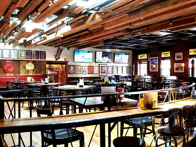 Exposed wooden beams create a ceiling that's part ski lodge, part beer hall, and entirely inviting – the kind of place where conversations flow as freely as the drafts.