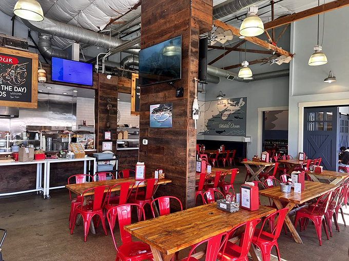 Industrial-chic meets seafood heaven inside, where those fire-engine red chairs aren't just stylish – they're preparing you for the heat of lobster passion.