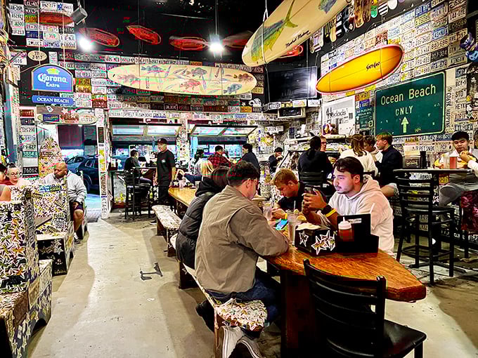 License plates from every corner of America line the walls while surfboards hang overhead. Organized chaos that somehow feels exactly right.