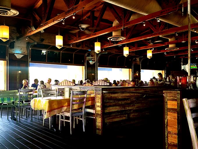 Exposed wooden beams and warm pendant lighting create that "fancy beach shack" vibe where you can dress up or down—just like your favorite seafood.