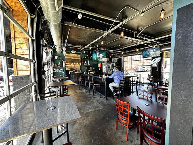 Industrial chic meets neighborhood comfort in this taproom where exposed ducts and pendant lighting create the perfect backdrop for serious sandwich consumption.