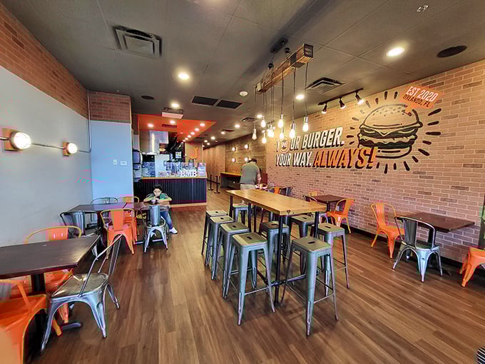 Industrial chic meets comfort food haven. That neon sign isn't lying—your burger, your way, always!