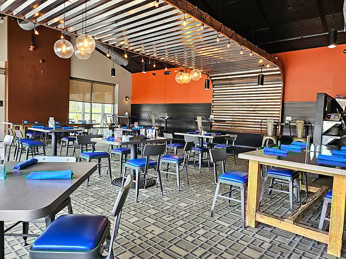 Industrial-chic meets cozy comfort inside Station 101, where orange walls and pendant lighting create the perfect backdrop for serious eating business.