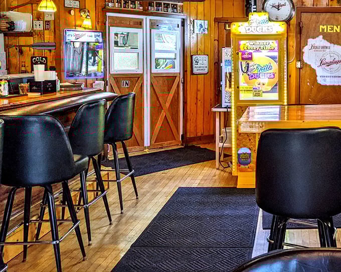 Wood paneling that whispers "comfort food ahead." This cozy interior feels like the cabin your luckiest friend owns—the one who can actually cook.