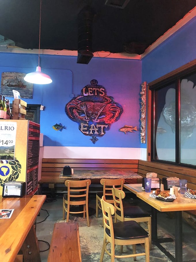 Blue walls and that commanding "LET'S EAT" crab sign—not so much a suggestion as the universe's most delicious directive.