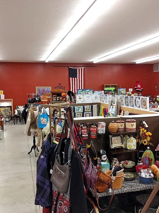 The iconic red walls serve as the perfect backdrop for this eclectic collection. Notice the American flag proudly displayed—patriotism meets vintage shopping at its finest.