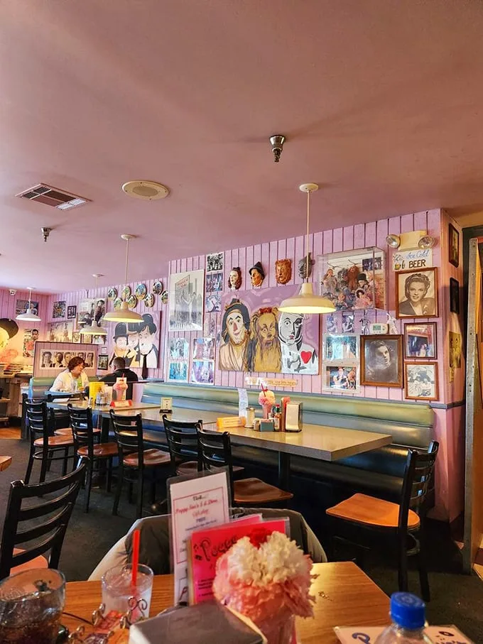 Pink walls, vintage memorabilia, and cozy booths create the perfect backdrop for conversations that flow as easily as the coffee.