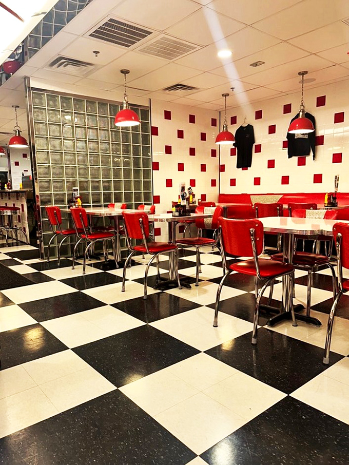 Classic red vinyl chairs and checkerboard floors transport you straight to the 1950s—no DeLorean required.