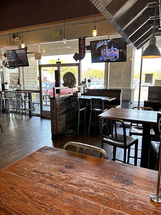Inside, rustic charm meets modern comfort—where wooden tables have witnessed countless sauce-splattered moments of pure joy.