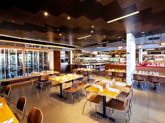 Inside, the modern industrial-meets-maritime design creates a space where New England tradition meets California cool. Those wooden tables have heard countless "oohs" over oysters.
