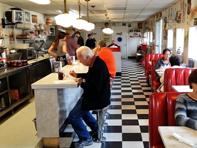Classic red vinyl booths and that iconic checkered floor—this isn't just a diner, it's a portal to when comfort food reigned supreme.