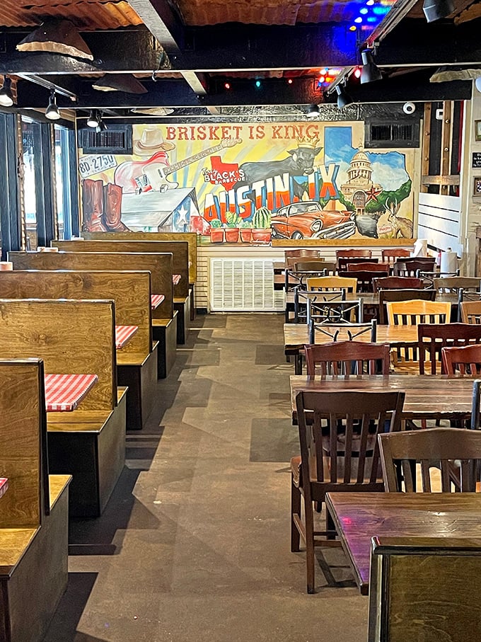 Wooden booths, simple chairs, and a mural declaring "Brisket is King." This dining room isn't trying to impress with decor—it's saving all the drama for your taste buds.