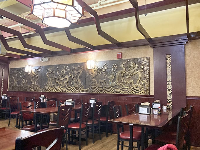 Dragons dance across ornate wall carvings while hexagonal lanterns cast a warm glow—proof that ambiance and all-you-can-eat aren't mutually exclusive concepts.