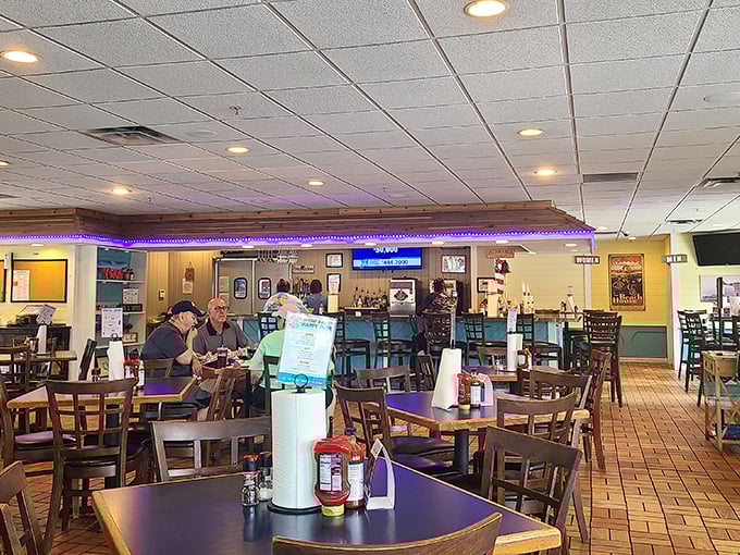 Inside, wooden chairs and purple accent lighting create that perfect "come as you are" atmosphere where seafood dreams come true.