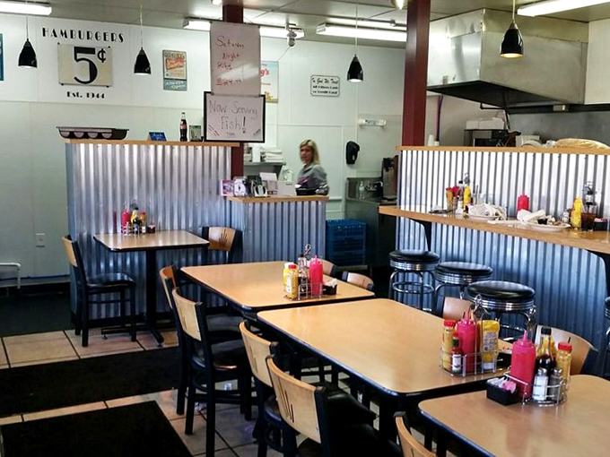 Inside, corrugated metal wainscoting and classic diner tables create that perfect balance of nostalgia and comfort—like a hug from your favorite aunt who can actually cook.