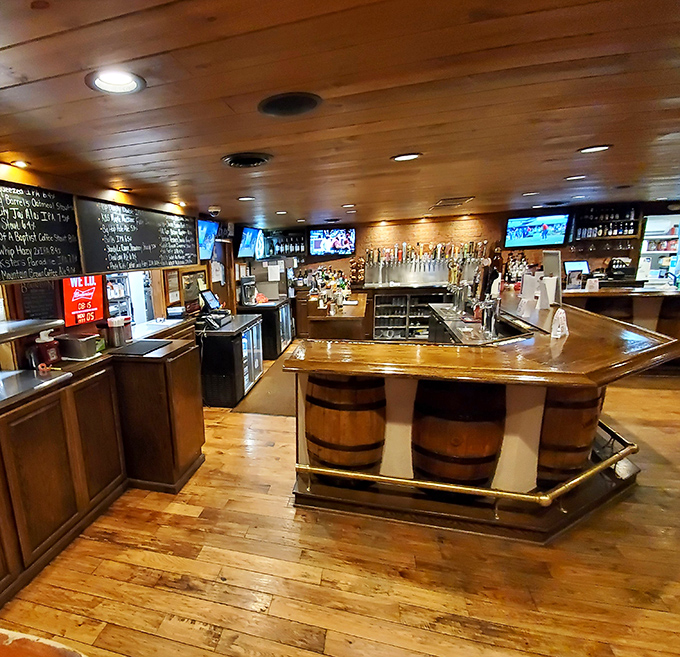 A bar that means business—wooden barrels, gleaming taps, and the promise of cold beer to wash down those legendary burgers.
