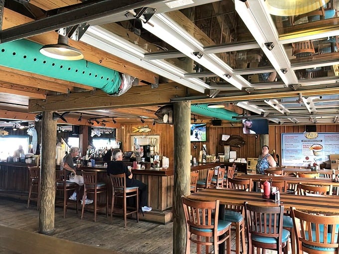 Wooden beams, nautical decor, and casual charm create the perfect backdrop for seafood feasting – like dining in a friend's beach house.