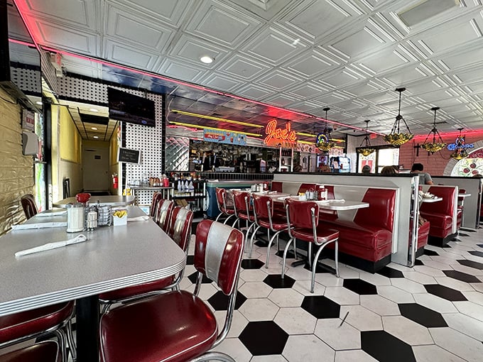 Classic diner perfection with red vinyl booths and a checkerboard floor—this isn't just a restaurant, it's a time machine that happens to serve incredible food.