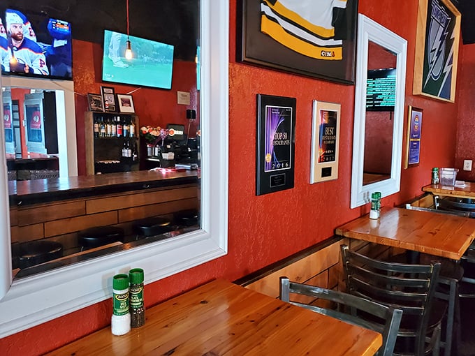 Red walls adorned with memorabilia create the perfect backdrop for burger-based epiphanies. This isn't just dining—it's a warm embrace.