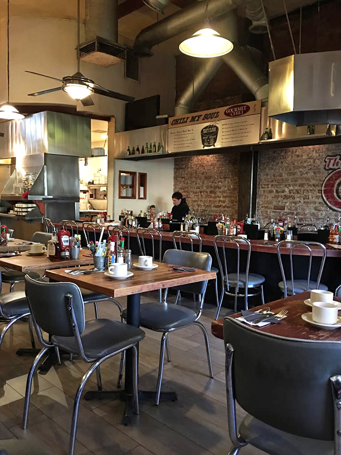 Industrial-chic meets morning comfort inside The Griddle, where exposed brick and wooden tables set the stage for pancake drama.