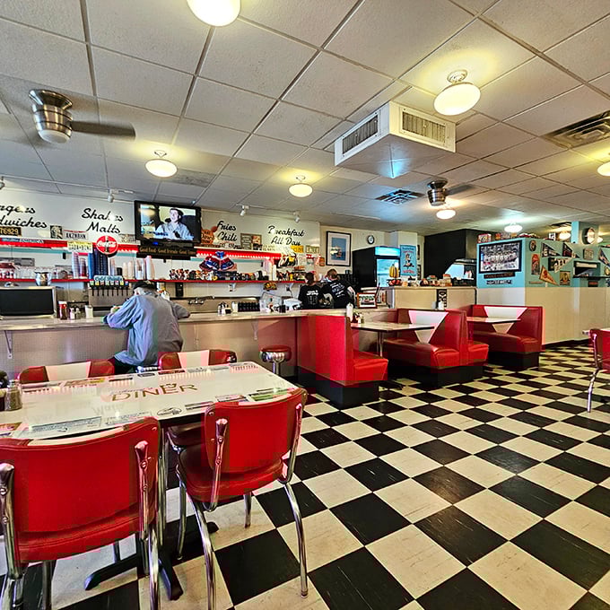 Classic black and white checkered floors meet fire-engine red booths in this time capsule where calories don't count and conversations flow freely.