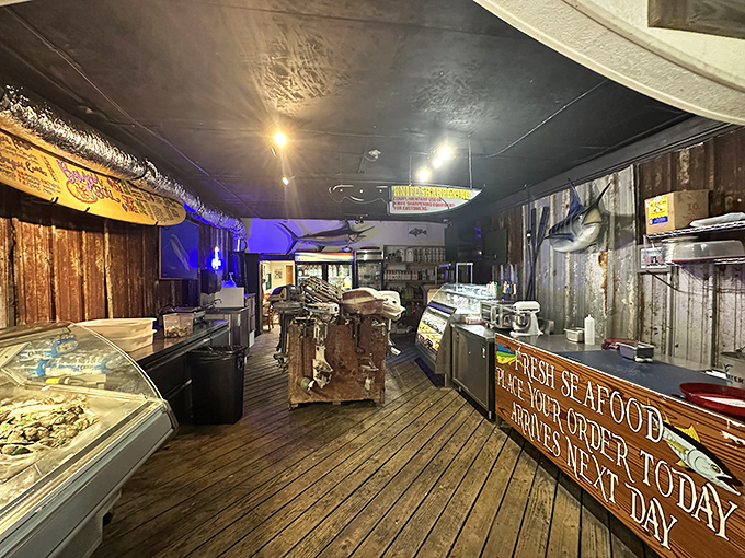 Where seafood dreams come true—rustic wooden floors, weathered walls, and a sign promising tomorrow's catch was swimming this morning.