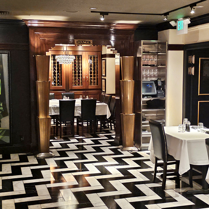 The Art Deco dream lives on with this dramatic black and white chevron floor, where every step feels like walking into a glamorous 1930s film set.
