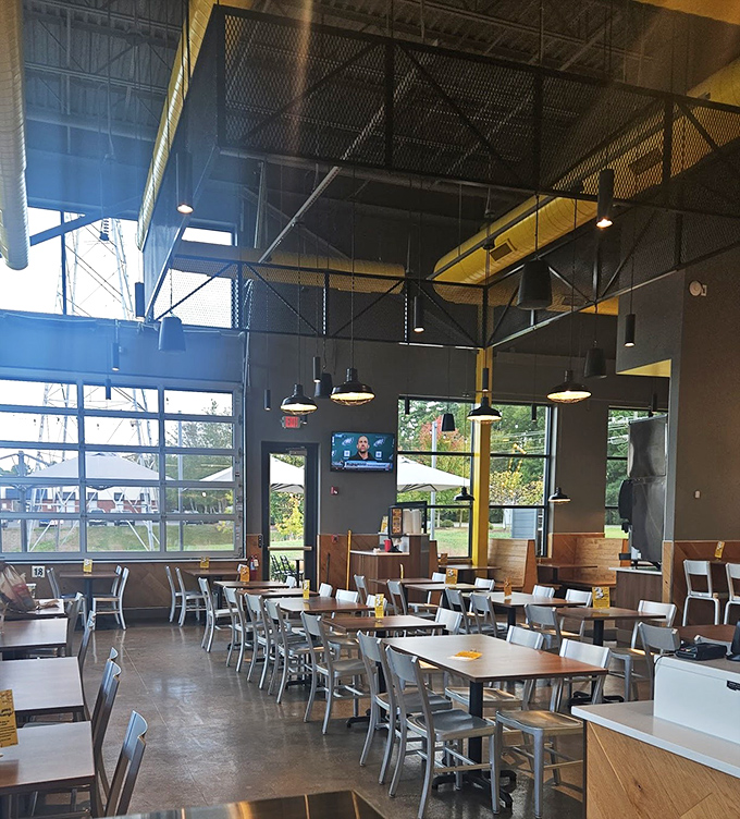 Industrial-chic meets comfort in this airy dining space. High ceilings, natural light, and the promise of crispy deliciousness—what more could you ask for?