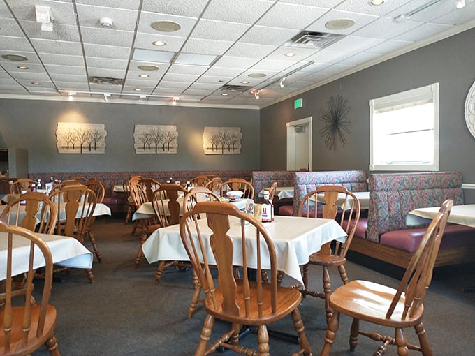 Classic Wisconsin supper club ambiance in full effect—wooden chairs, white tablecloths, and the promise of carnivorous delights to come.